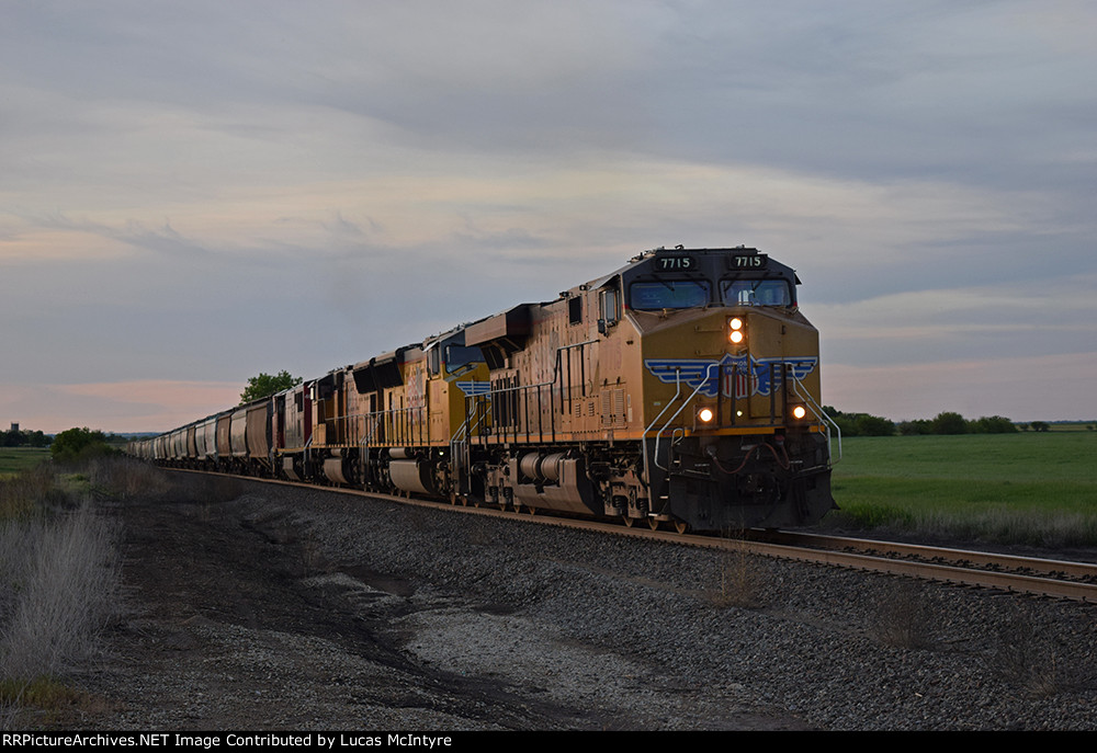 UP 7715 eastbound UP loaded grain train